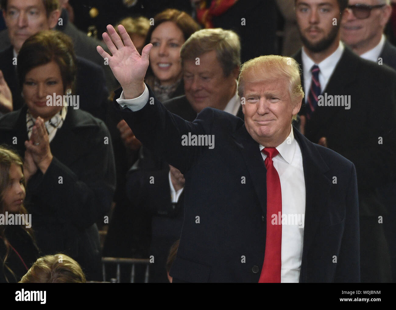 President Donald J. Trump waves from the viewing area during the Trump ...