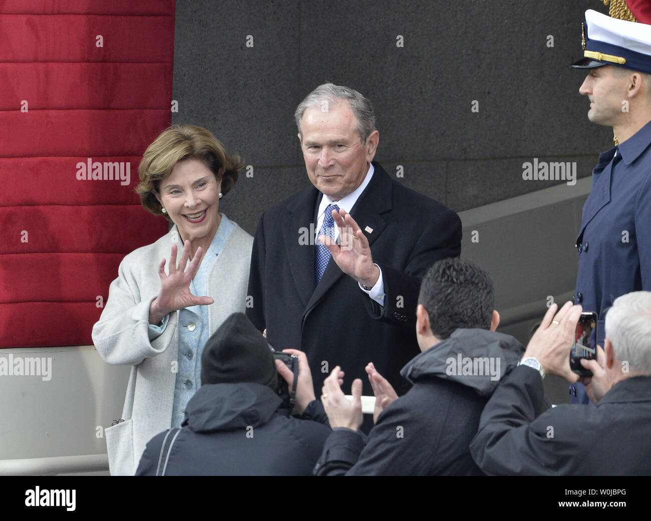 Former President George Bush and wife Laura arrive for the inauguration ...