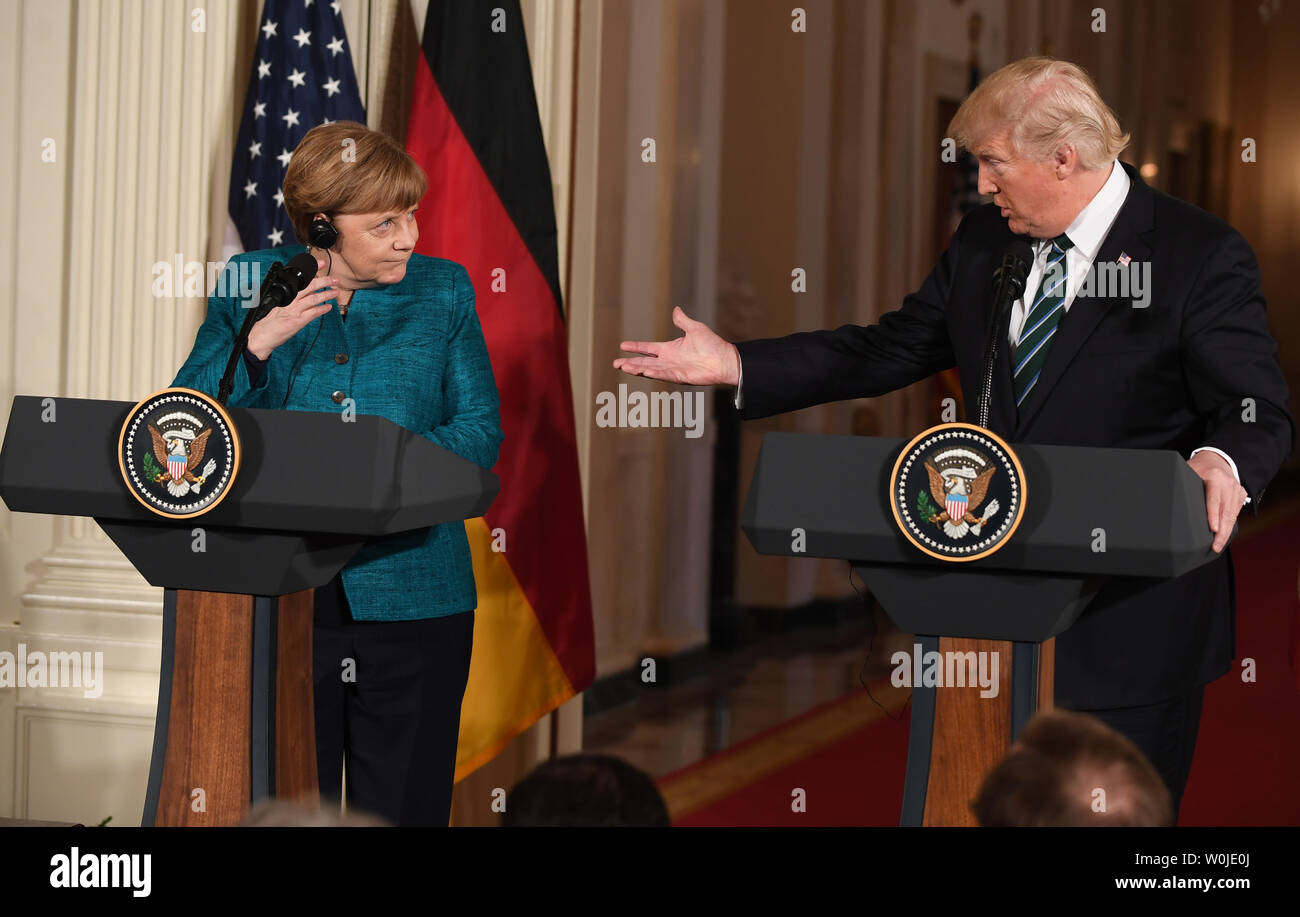 German Chancellor Angela Merkel (L), and President Donald Trump hold a ...