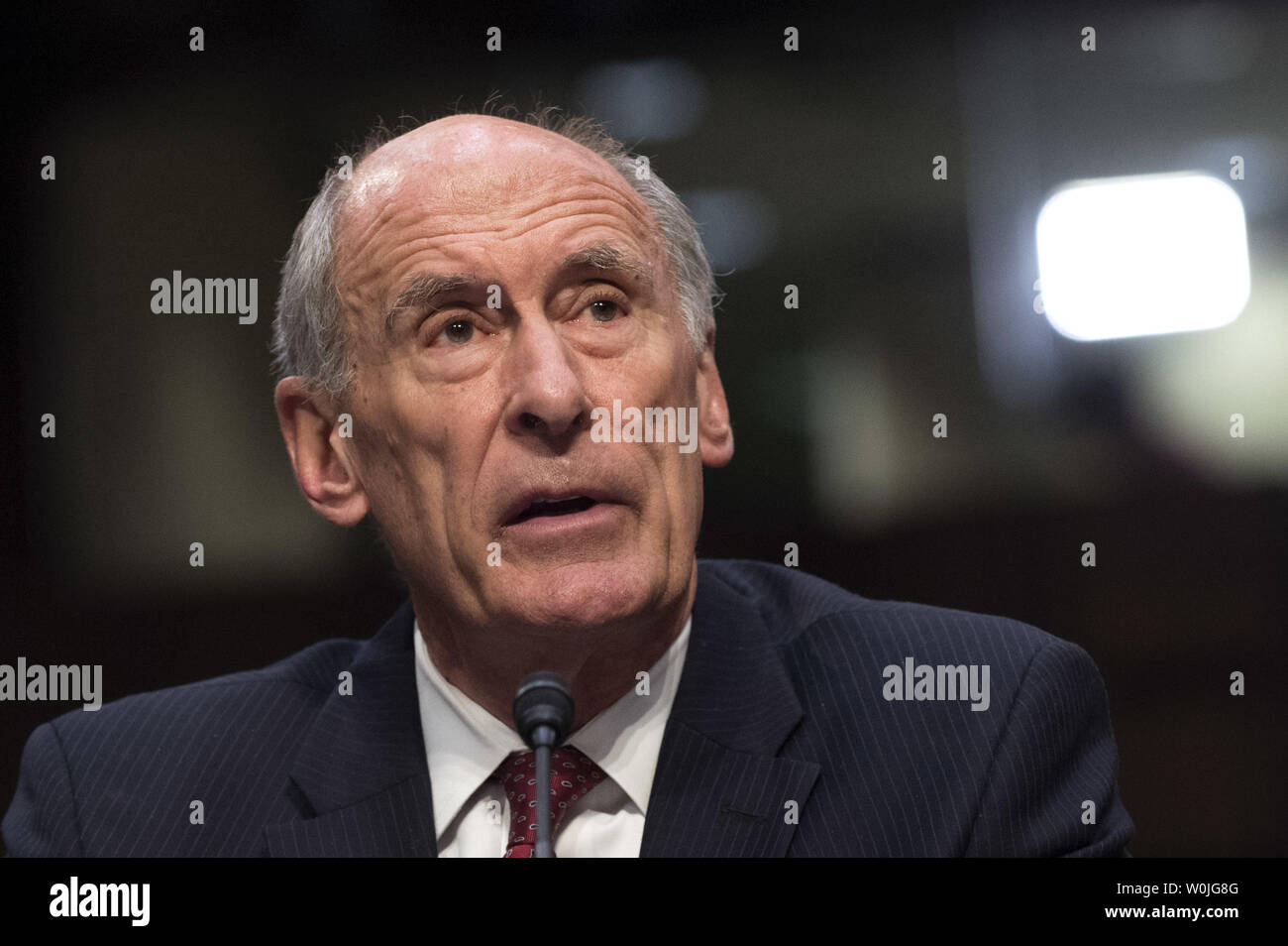 Dan Coats, Director of National Intelligence (DNI), testifies during a ...