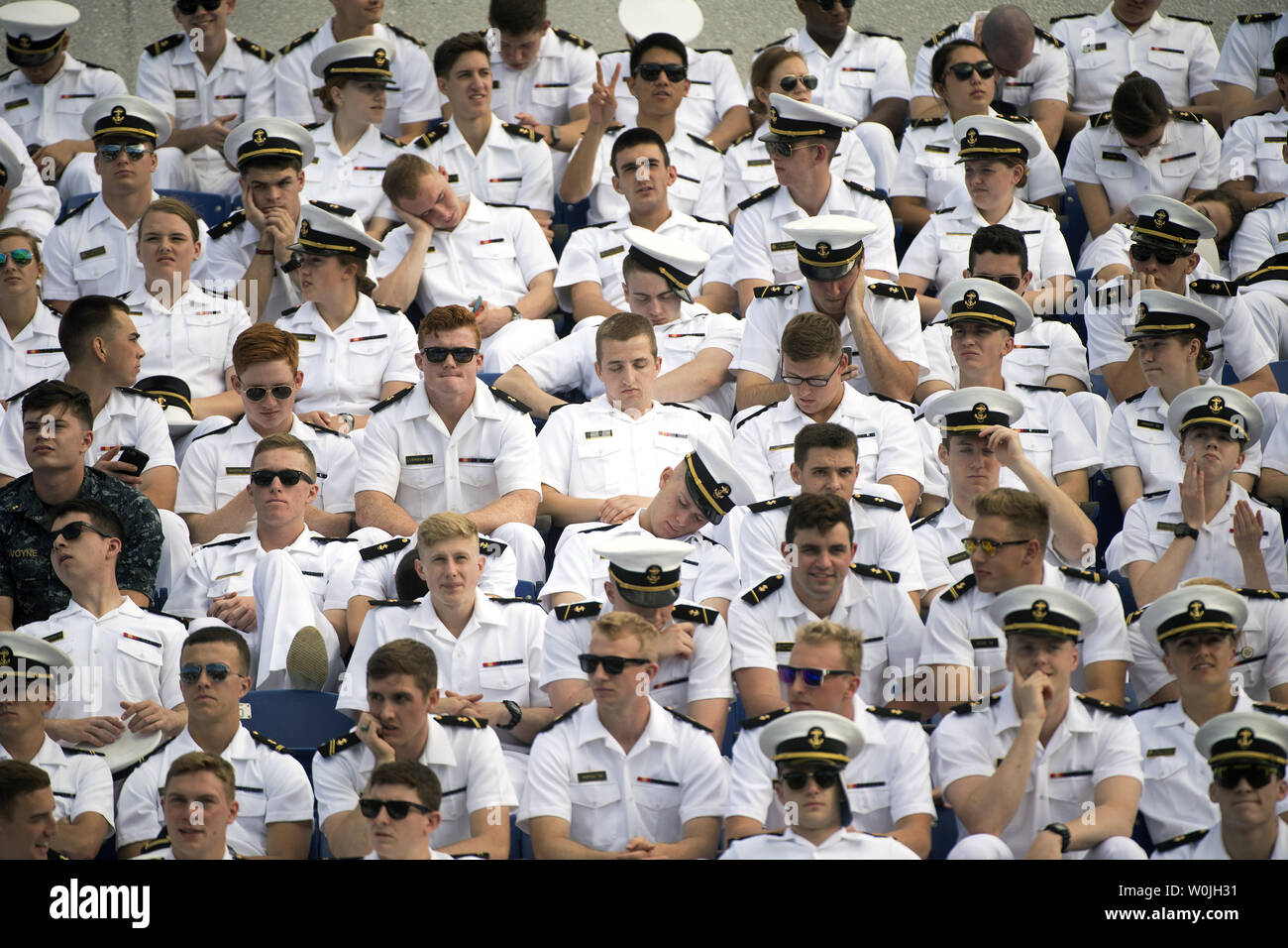 Underclass midshipmen wait for the start of the Graduation and ...
