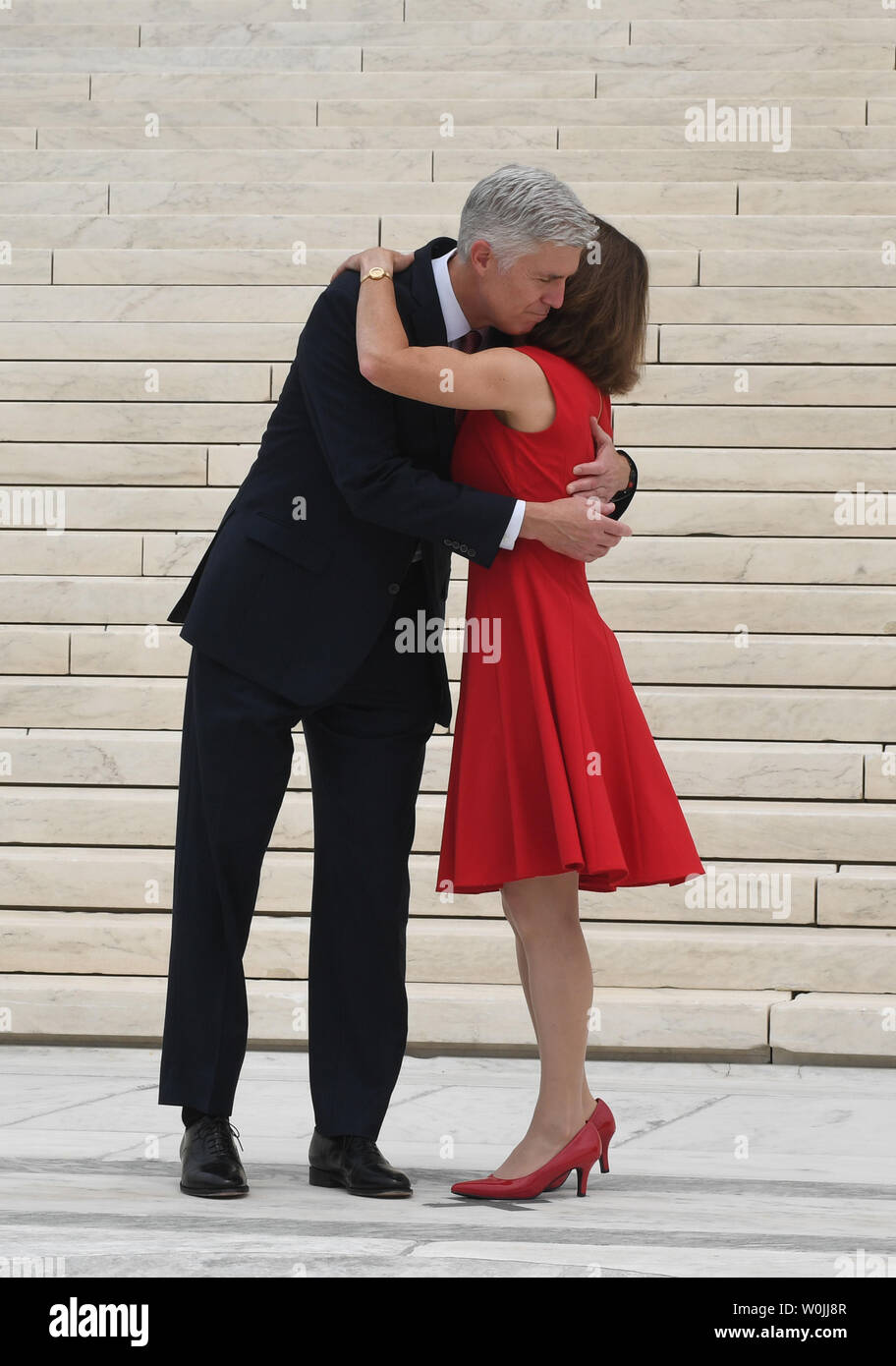 Associate Justice Neil Gorsuch (L) embraces his wife Marie Louise on ...