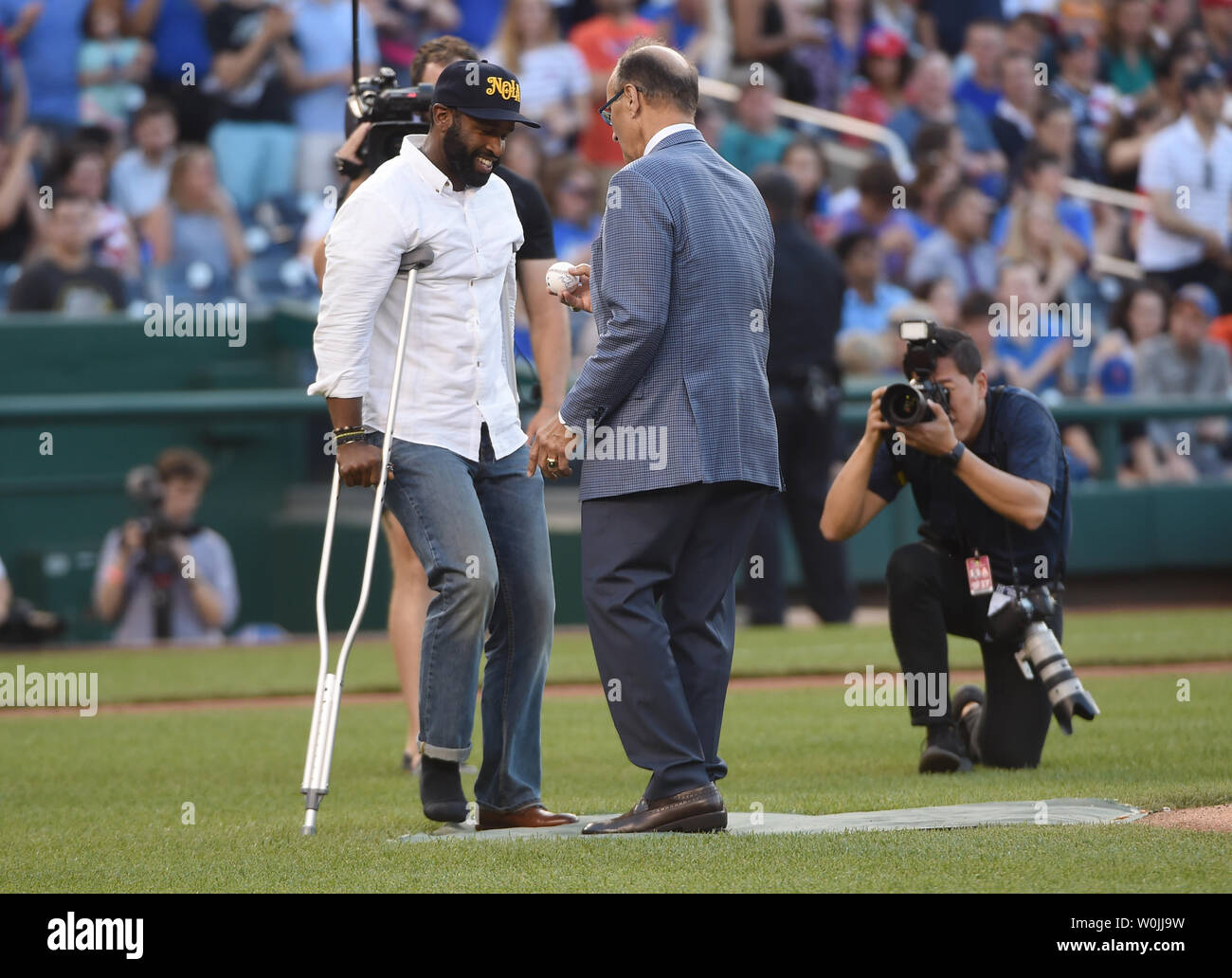 Capitol Police Officer David Bailey is greeted by Joe Torre to throw ...