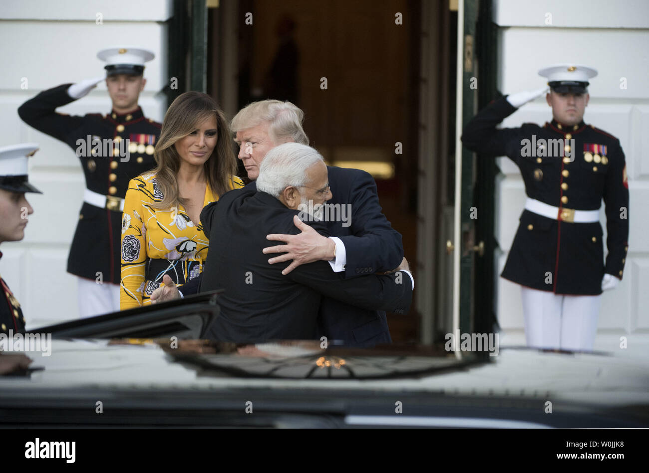 President Donald Trump and Indian Prime Minister Narendra Modi hug as ...
