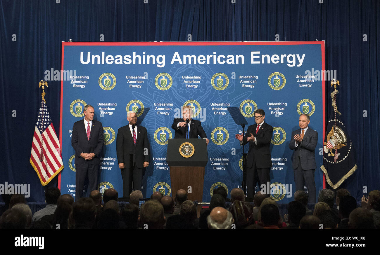 President Donald Trump (L) delivers remarks at the Unleashing American ...