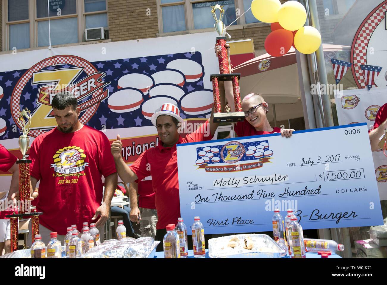 First place winner Molly Schuyler (R) celebrates with Z-Burger founder ...