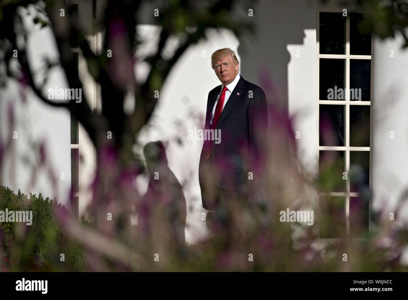 U.S. President Donald Trump walks toward Oval Office of the White House ...