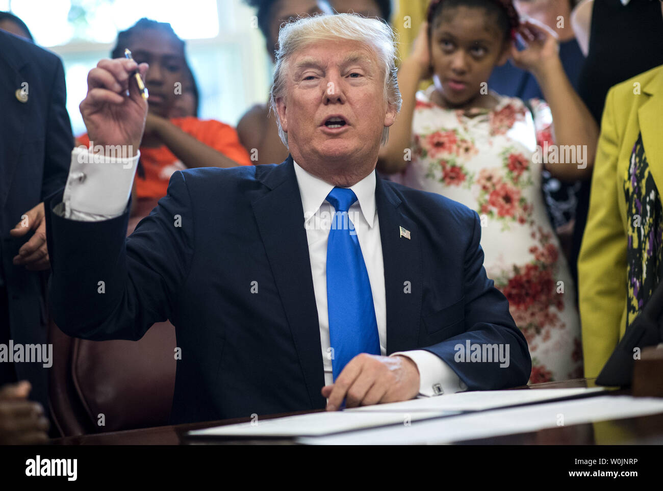 President Donald Trump speaks alongside students before signing a ...