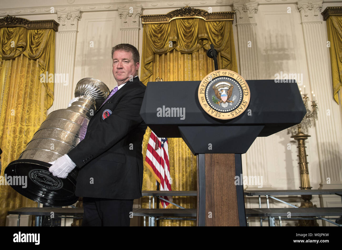 Mike Bolt, with the Hockey Hall of Fame, holds the Stanley Cup prior to ...