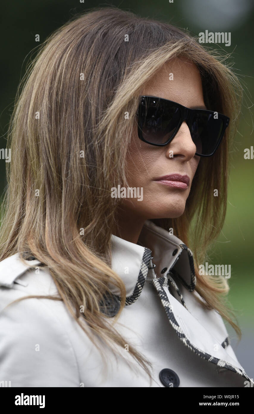 First Lady Melania Trump waits as President Trump speaks with members ...