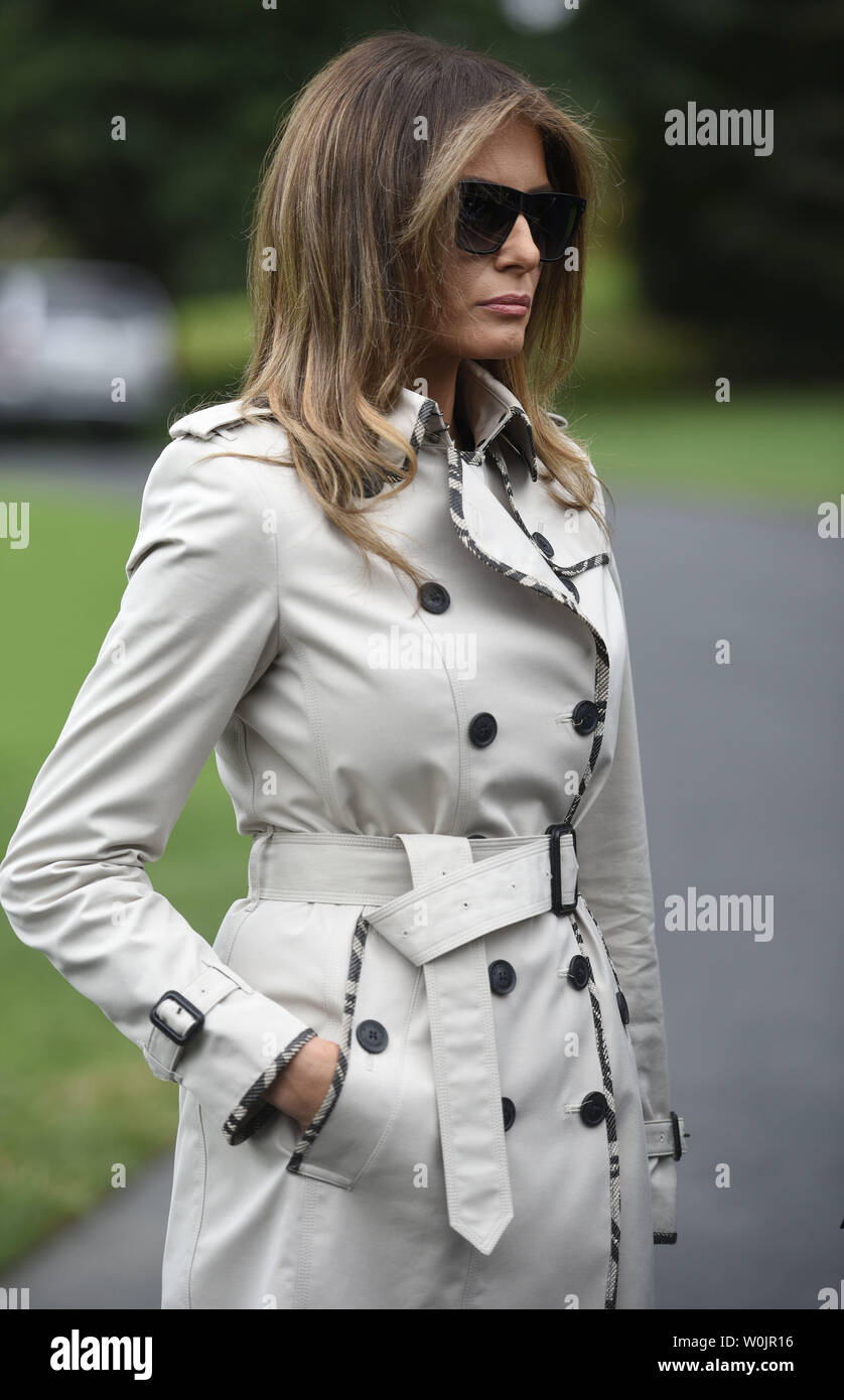 First Lady Melania Trump waits as President Trump speaks with members ...