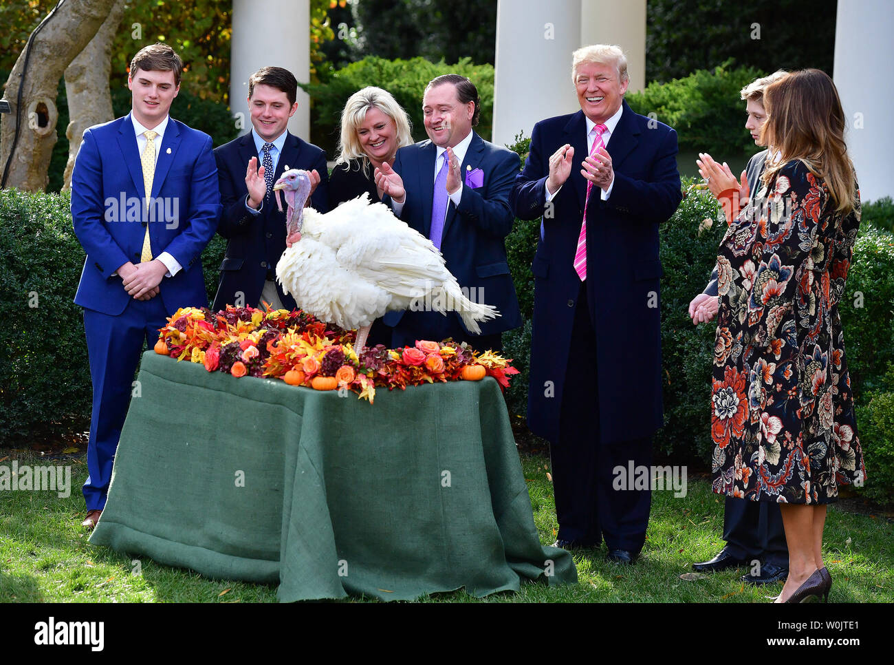 President Donald Trump (3rd-R) pardons Drumstick, the National ...