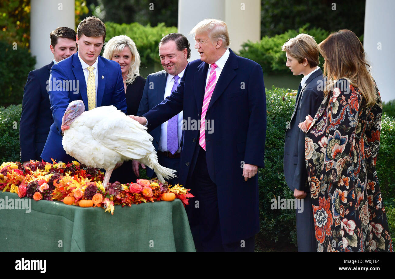 President Donald Trump (3rd-R) pardons Drumstick, the National ...