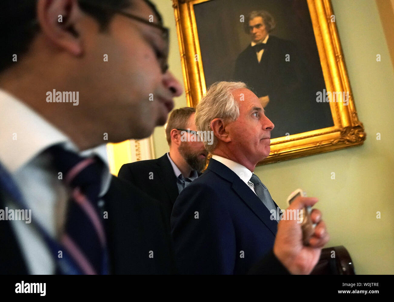 Sen. Bob Corker, R-TN, talks to the media as he arrives to a meeting on ...