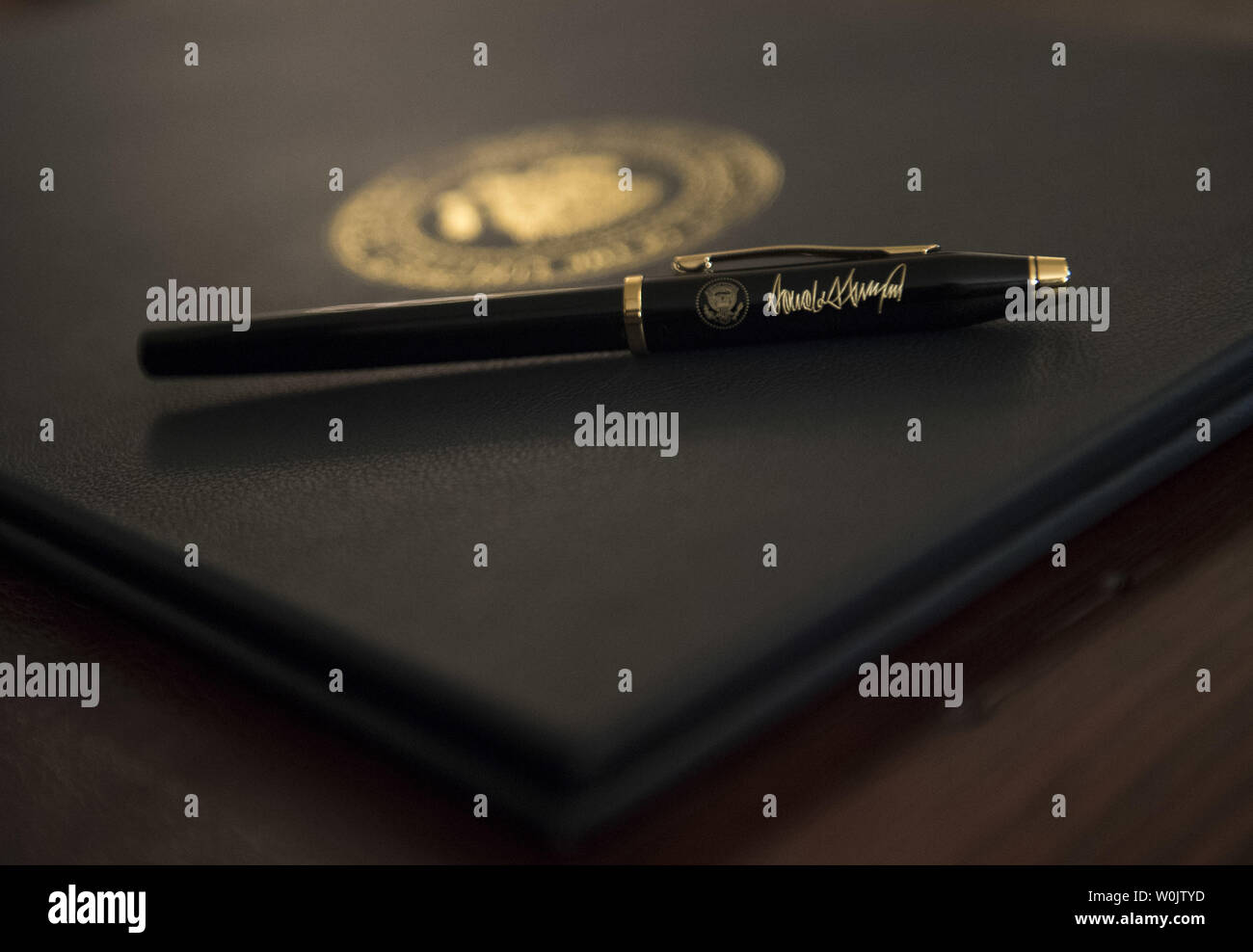 A pen with President Donald Trump's signature is seen on a proclamation ...