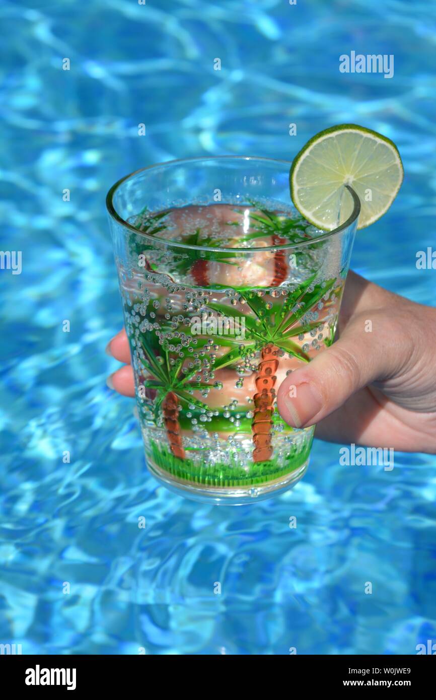Hand holding cocktail swimming pool hi-res stock photography and images ...