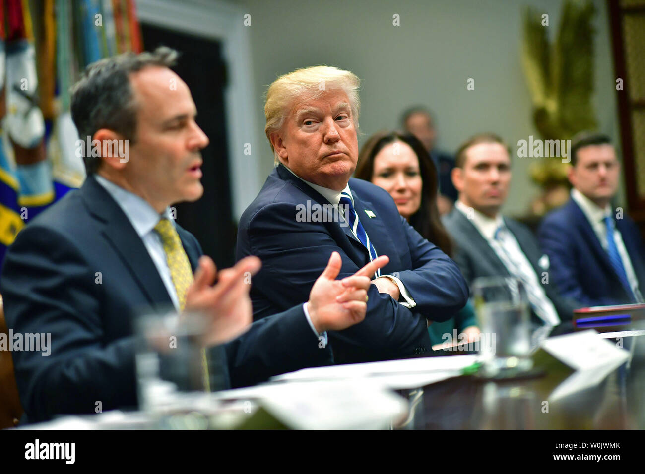 President Donald J. Trump listens to Kentucky Governor Matt Bevin ...