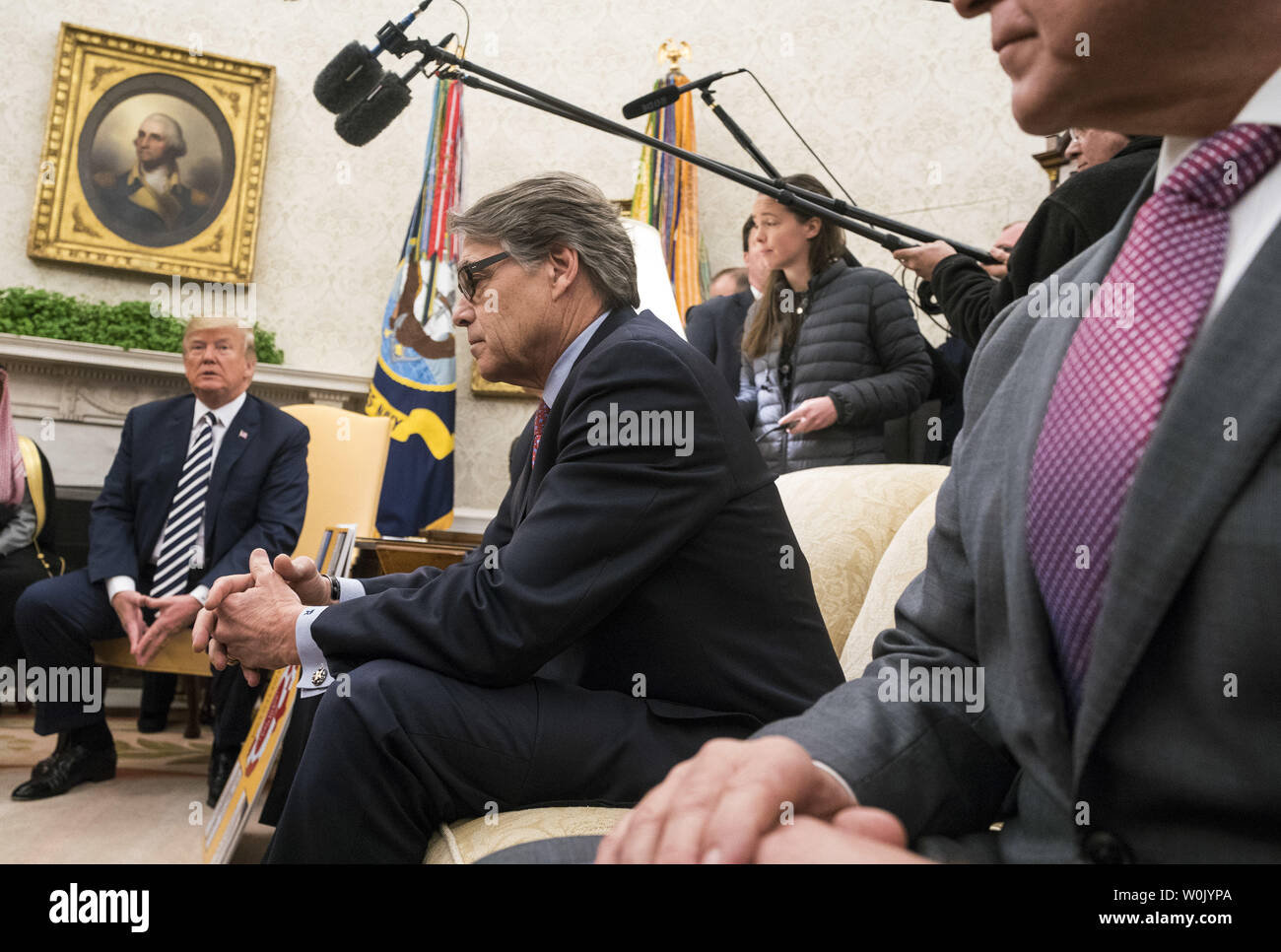 Energy Secretary Rick Perry (C) attends a meeting with President Donald ...