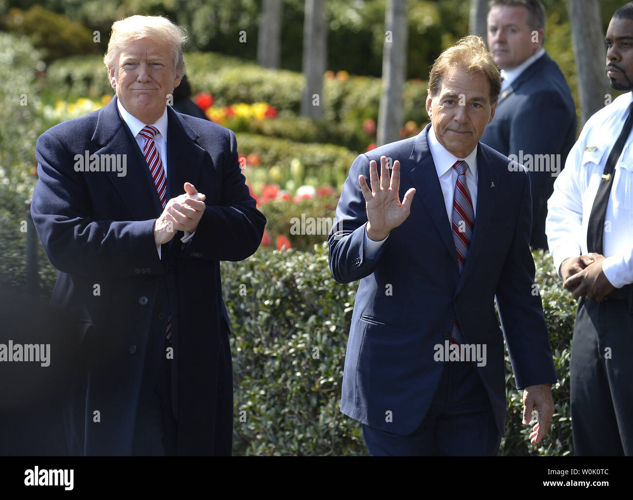 President Donald Trump (L) arrives with University of Alabama Head ...