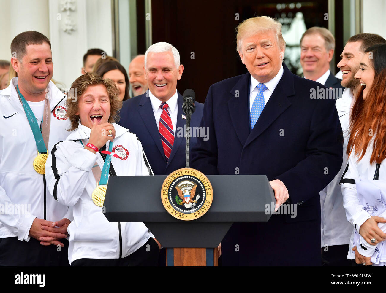 Gerard Redmond (2nd-L), slopestyle gold medalist, laughs alongside ...