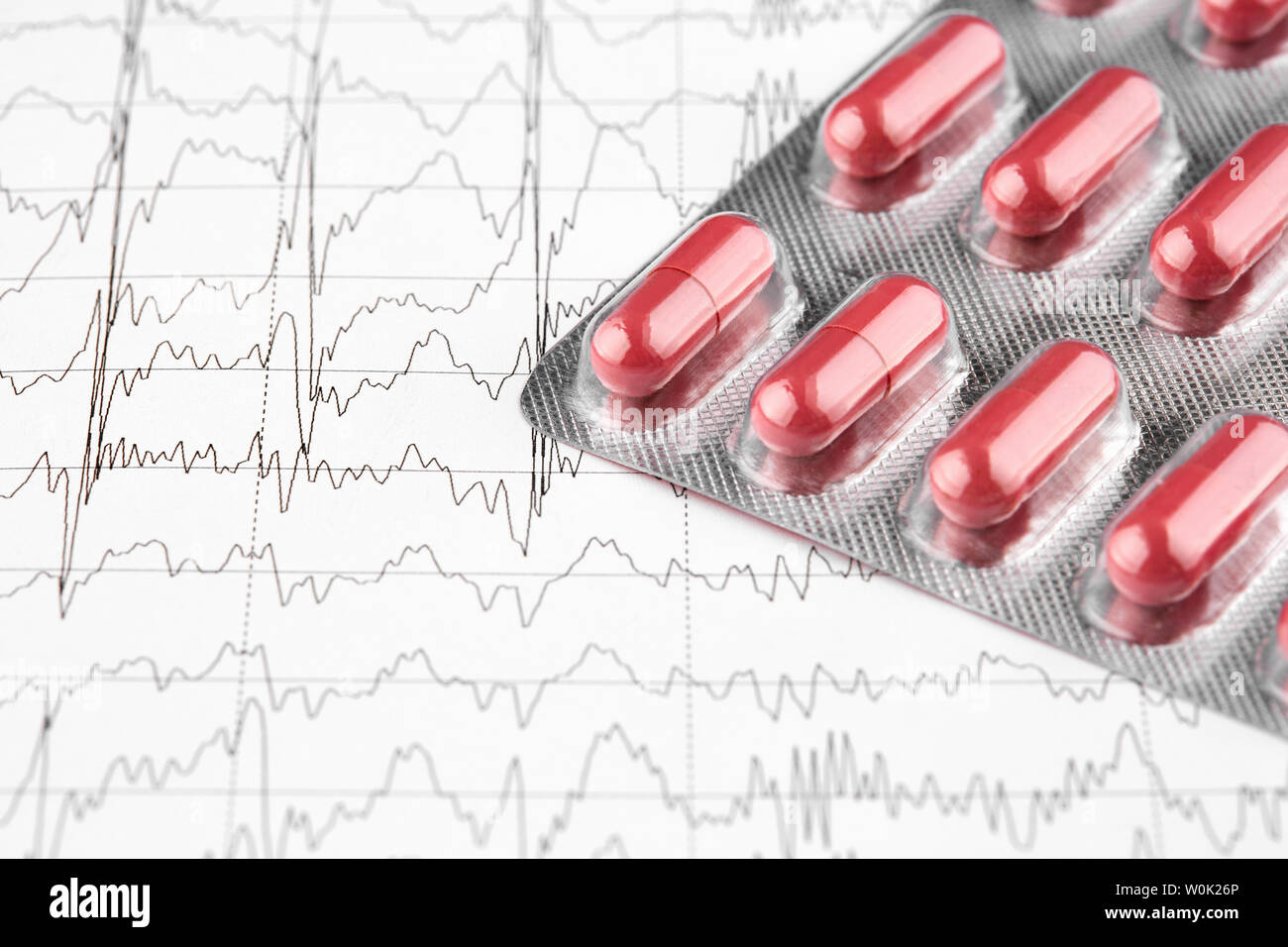 Close-up photo of blister with red pills on EKG graph Stock Photo - Alamy
