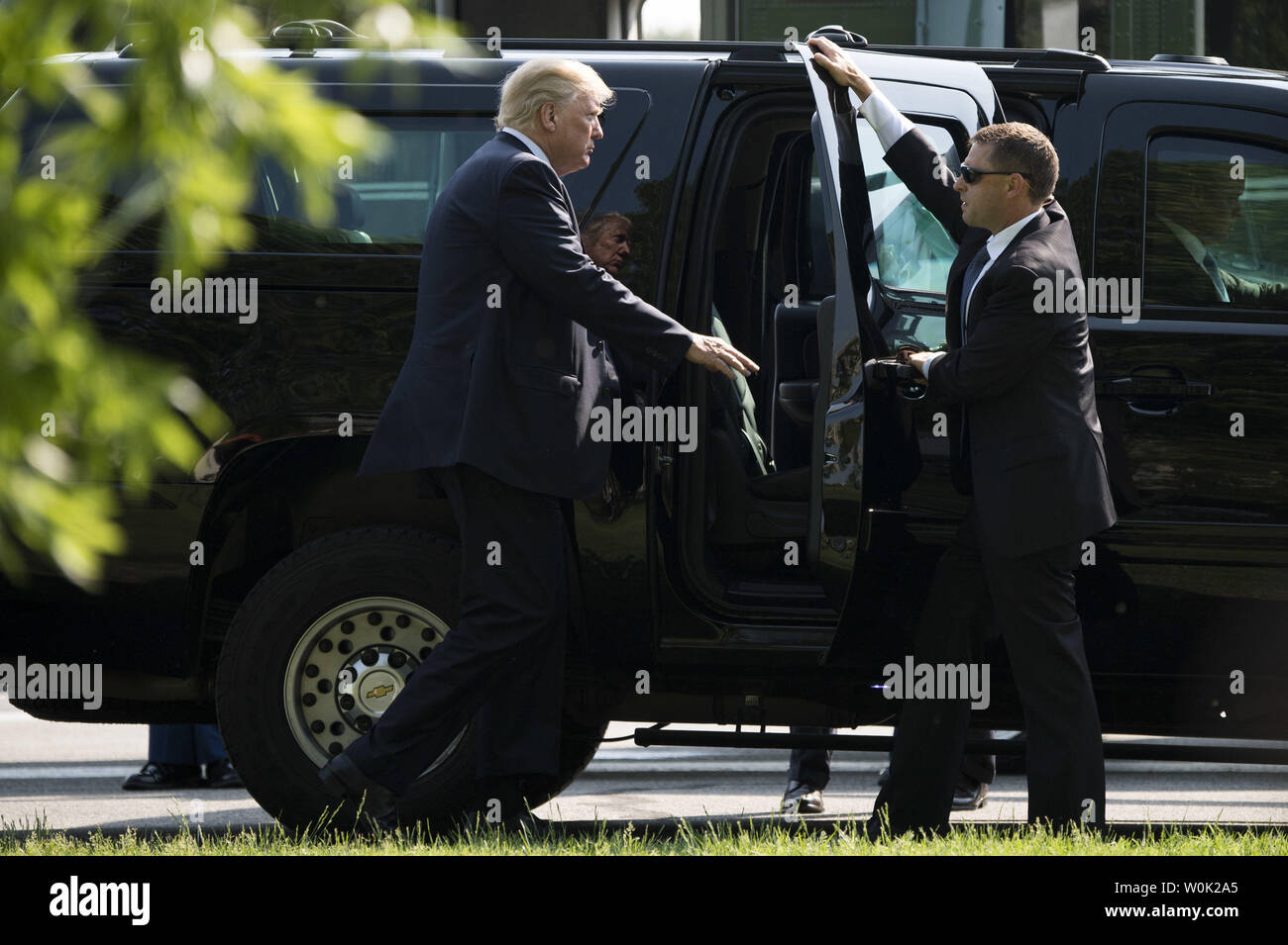 President Donald Trump arrives at Walter Reed Medical Center to visit ...