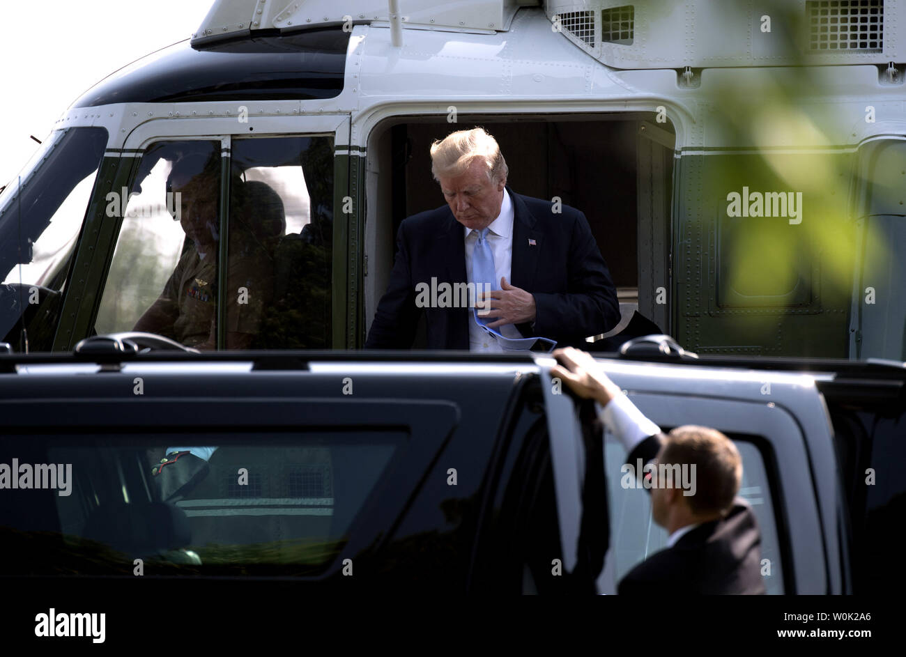 President Donald Trump arrives at Walter Reed Medical Center to visit ...