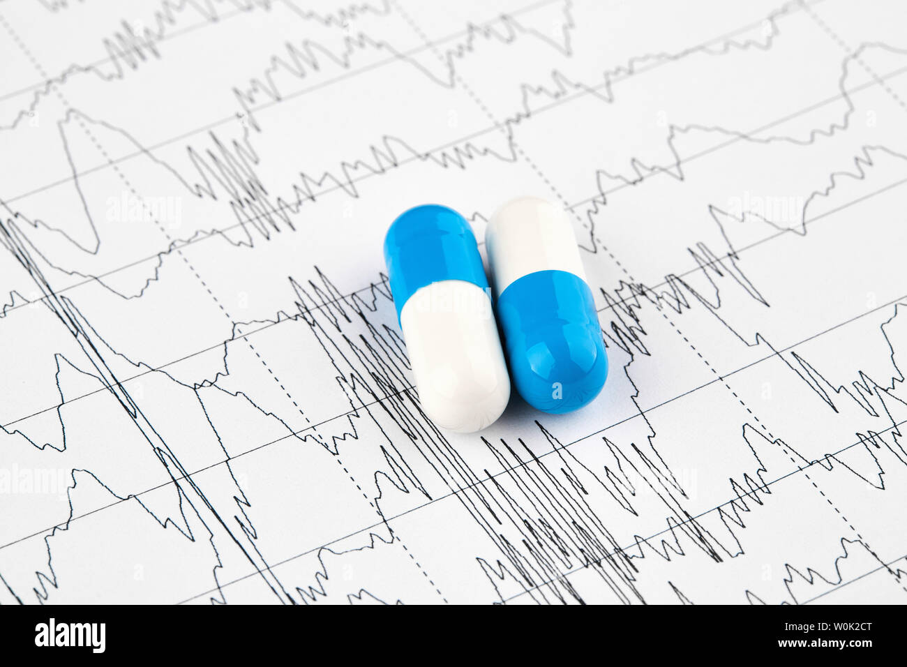 Close-up photo of white and blue pills on EKG graph Stock Photo - Alamy