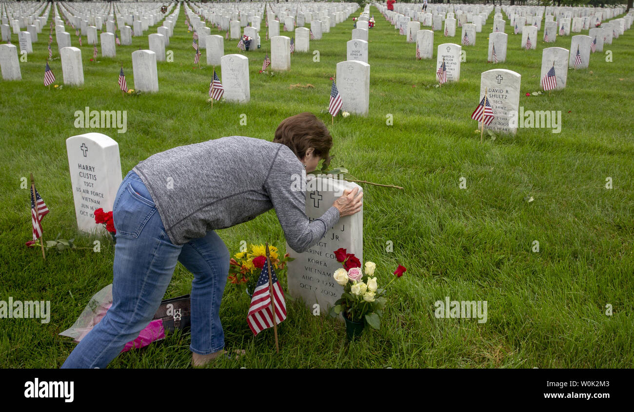 Marjoie Weeda kisses the gravestone of her husband Anthony J Weeda at ...