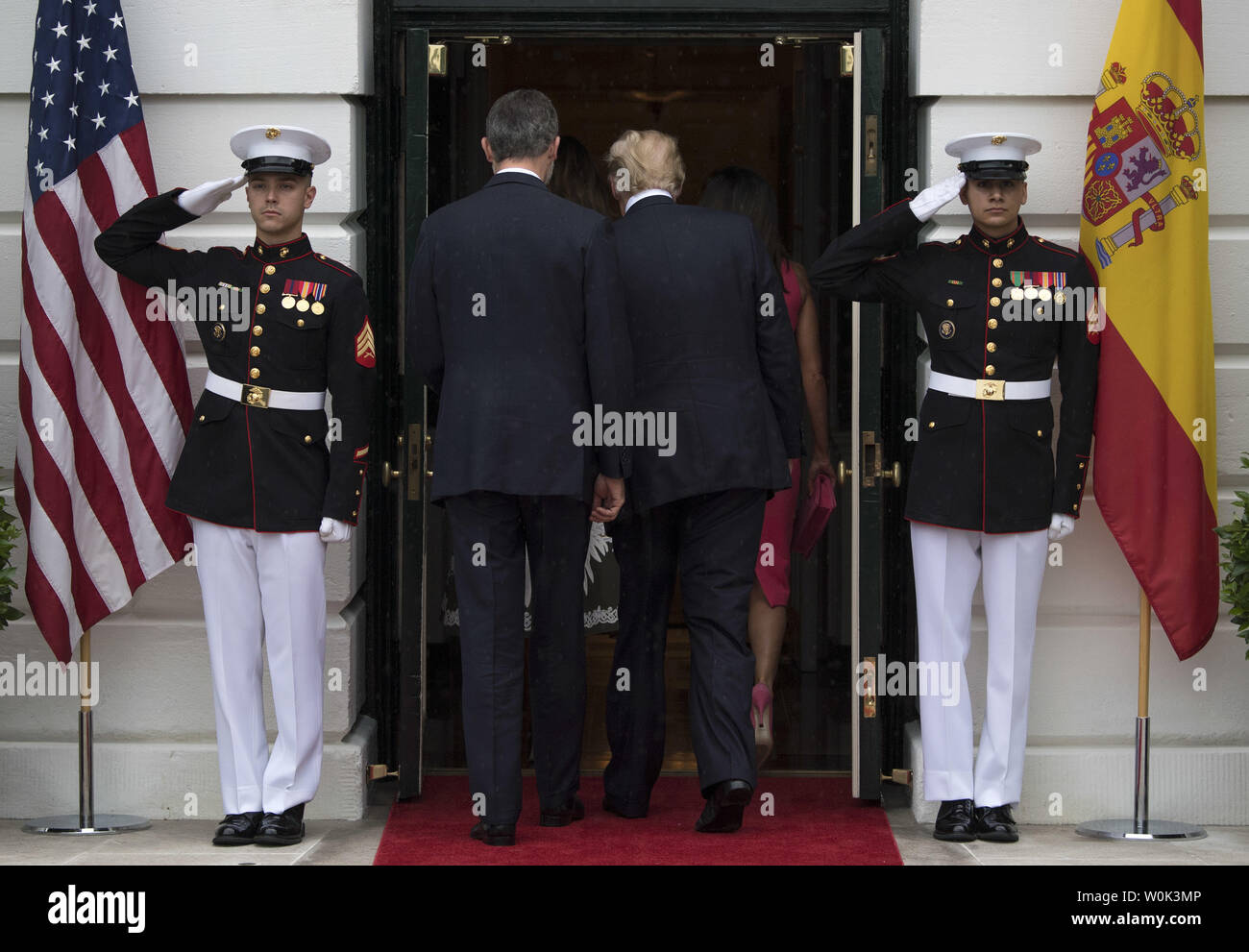 President Donald Trump and King Felipe VI of Spain walk into the White ...
