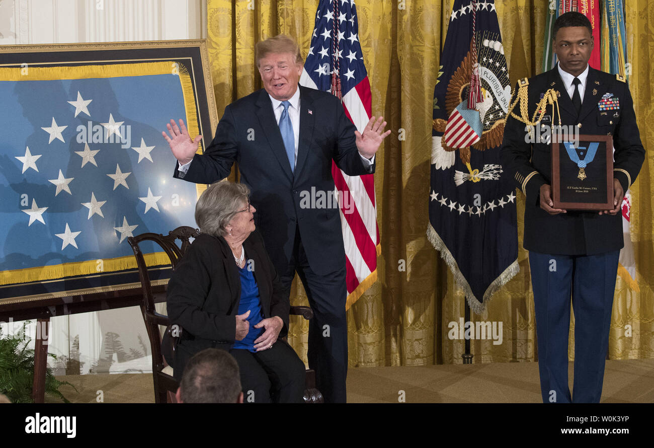 President Donald Trump stands with Pauline Lyda Wells Conner the widow ...