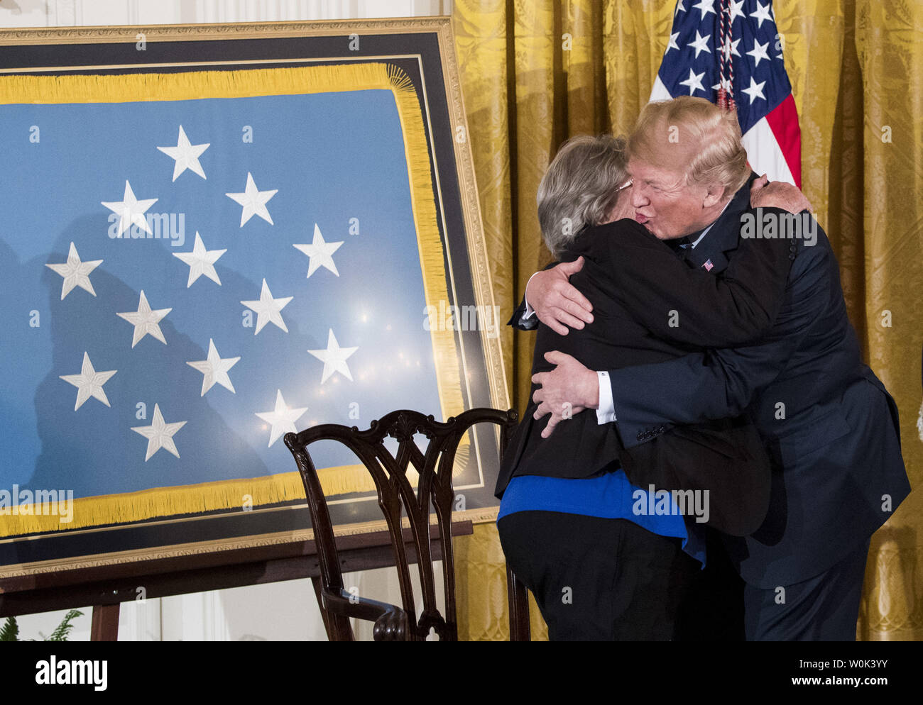 President Donald Trump hugs Pauline Lyda Wells Conner the widow of Army ...