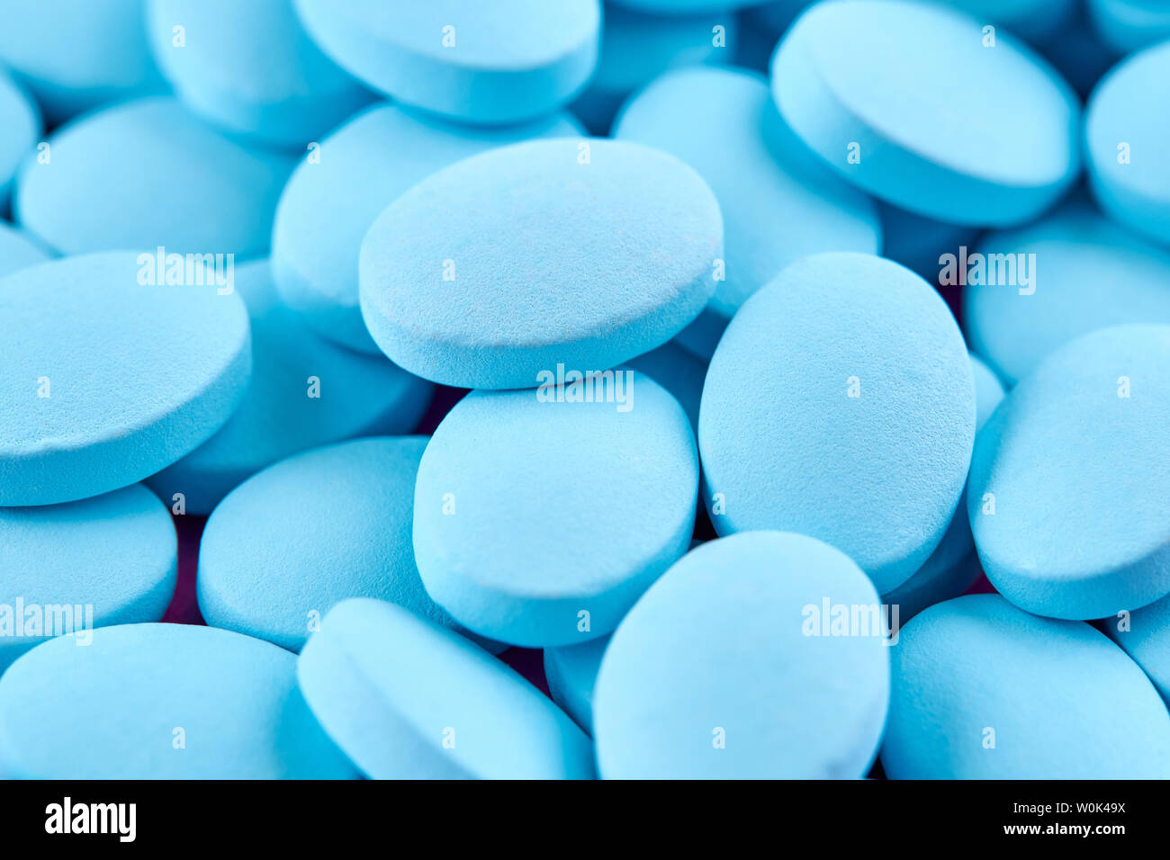 Macro photo of many blue pills. Medical Stock Photo - Alamy