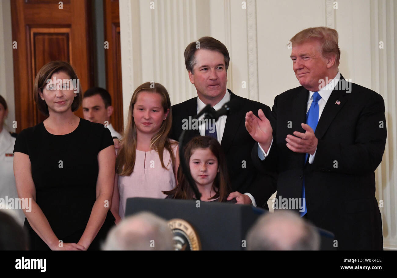 President Donald Trump applauds as he introduces Brett Kavanaugh as his ...