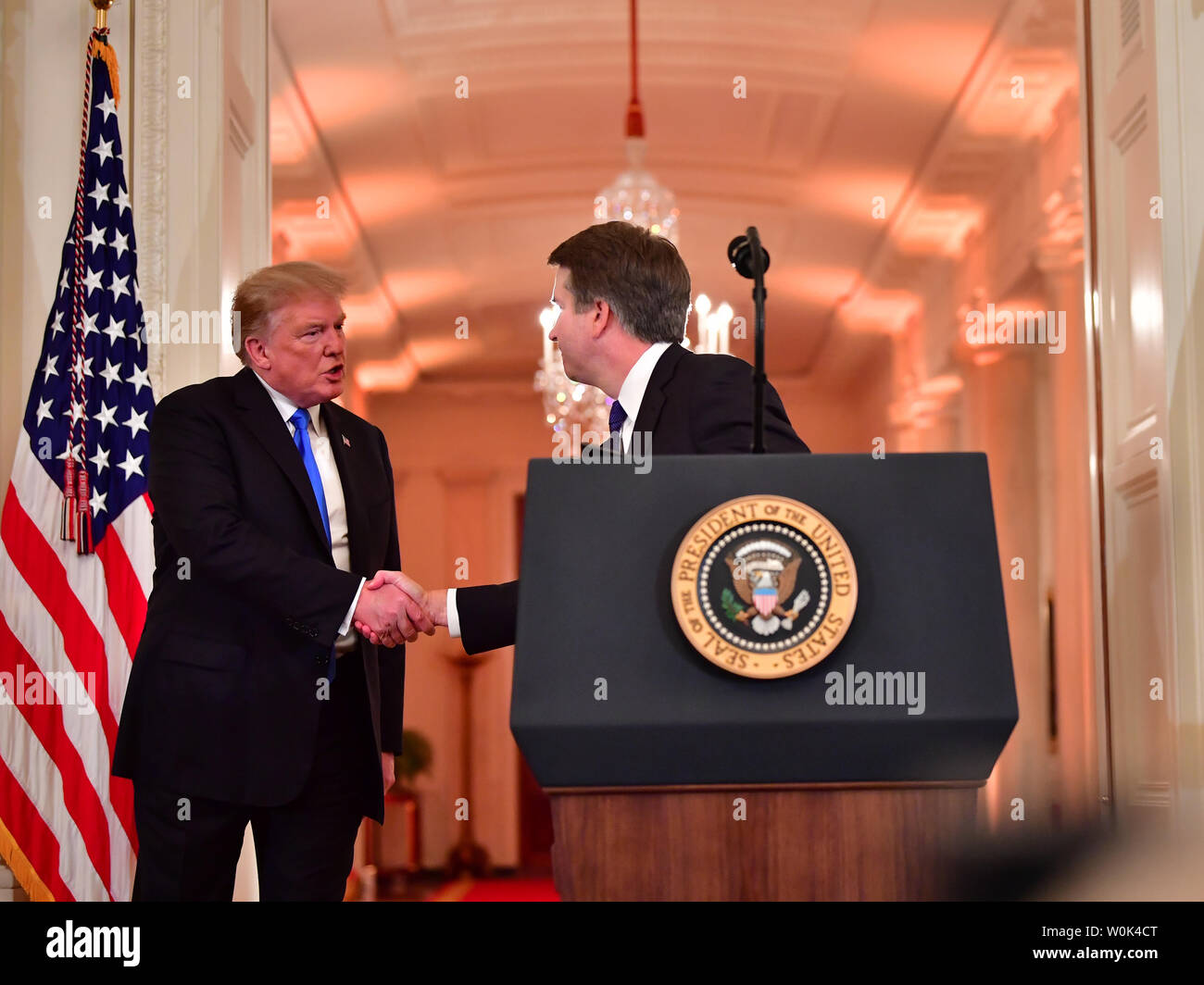 President Donald Trump shakes hands with Brett Kavanaugh, his nominee ...