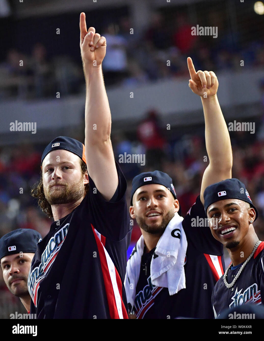 Gerrit Cole and George Springer celebrate as teammate Alex Bergman ...