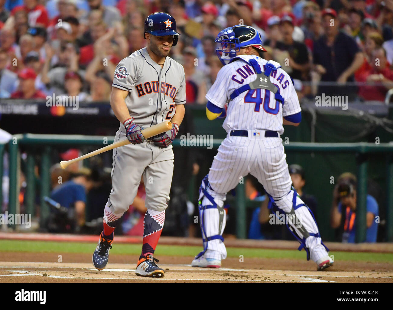 Houston Astros second baseman Jose Altuve (27) strikes out in front of ...