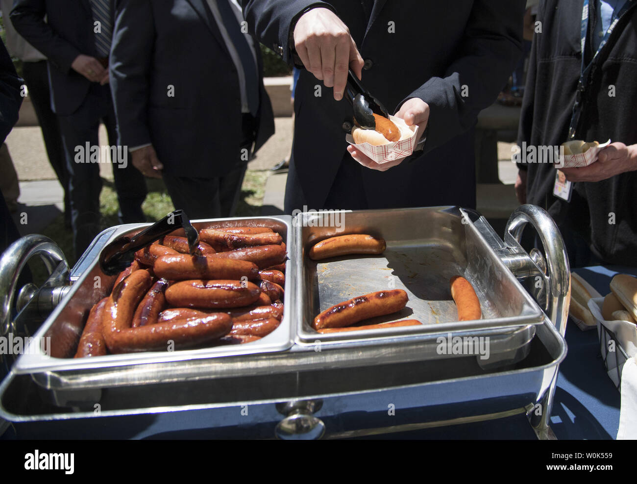 Congressional staff and visitors line up for a hotdog at the ...
