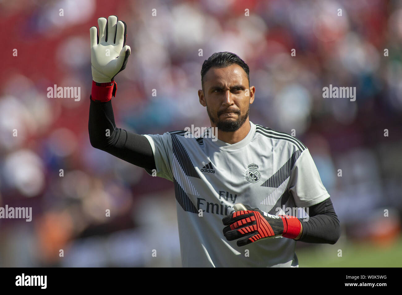 Real Madrid goalkeeper Keylor Navas (1) waves to fans as he warms up ...
