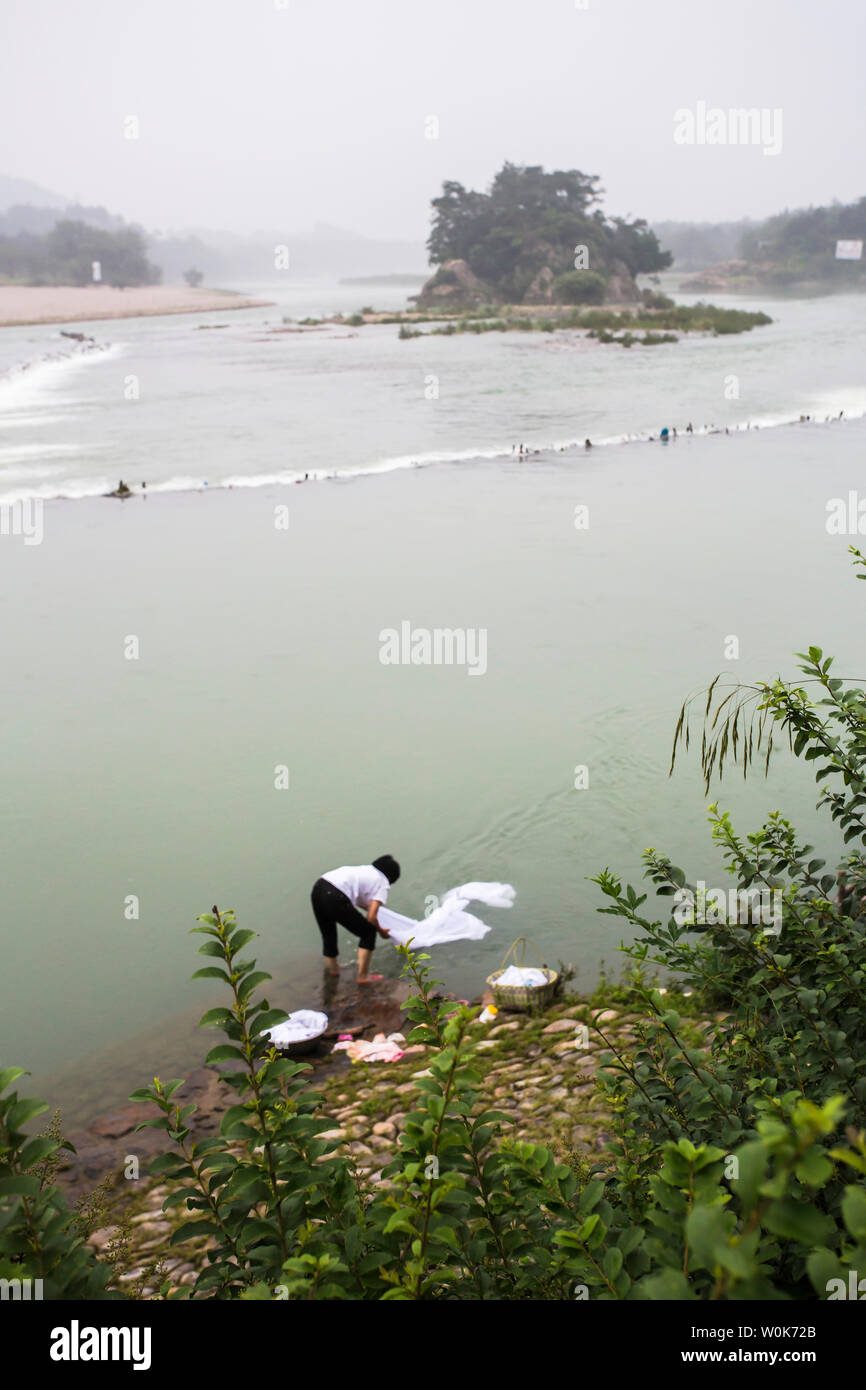 Riverside washing hi-res stock photography and images - Alamy