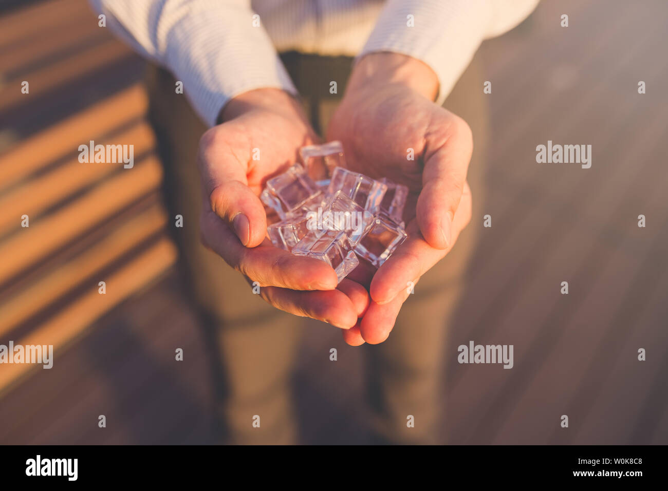 Man holding ice cubes hi-res stock photography and images - Alamy