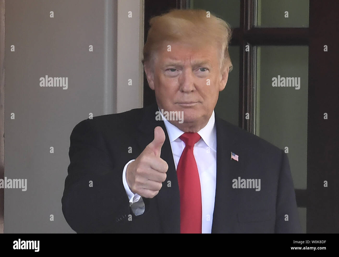 President Donald Trump gives a thumbs up to the press after seeing ...