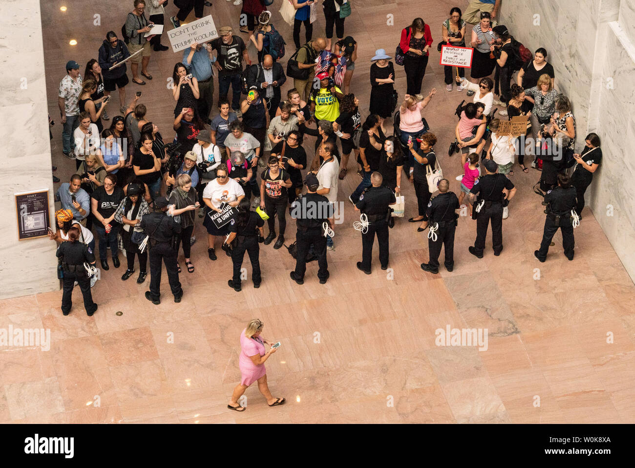 Activists and general public are held back from entering the atrium of ...