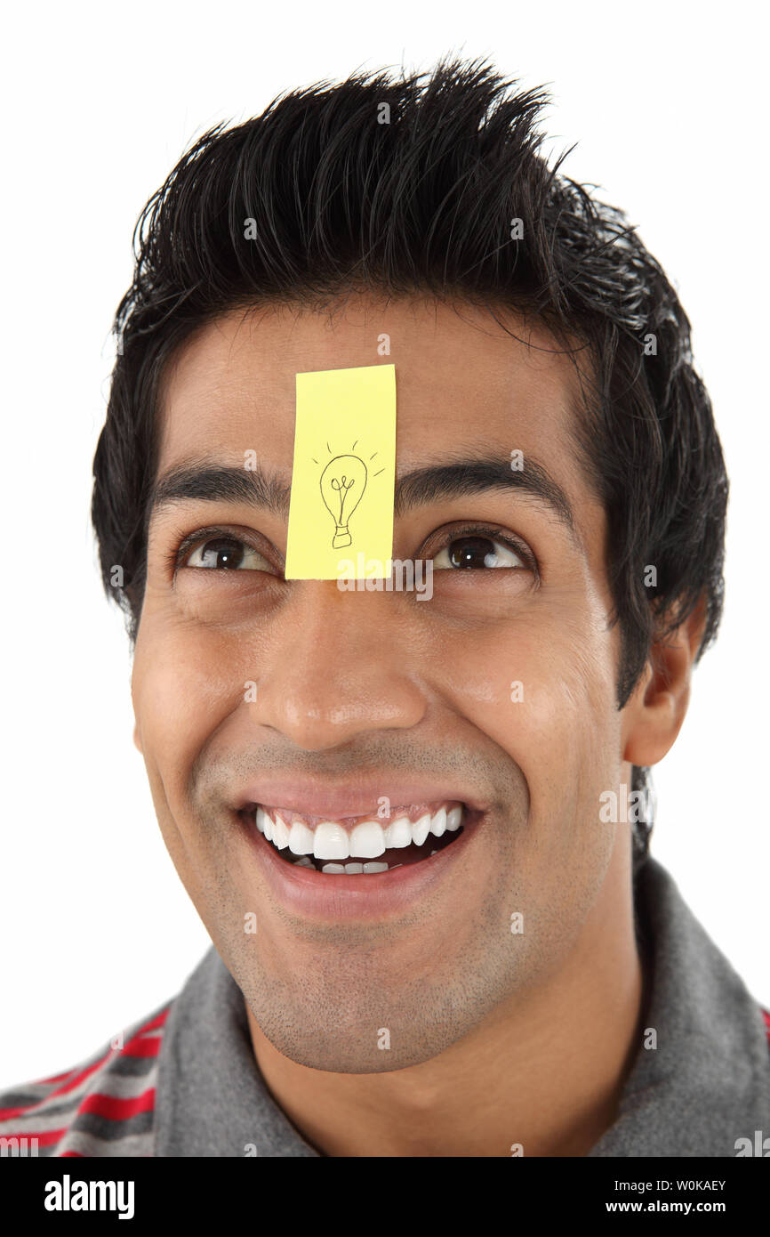 Man with an adhesive note on his forehead Stock Photo - Alamy