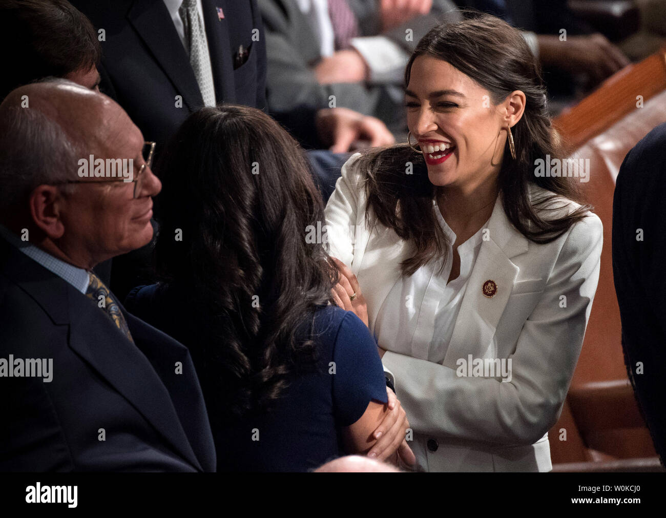 Rep. Alexandria Ocasio-Cortez, D-NY, talks with fellow members of ...