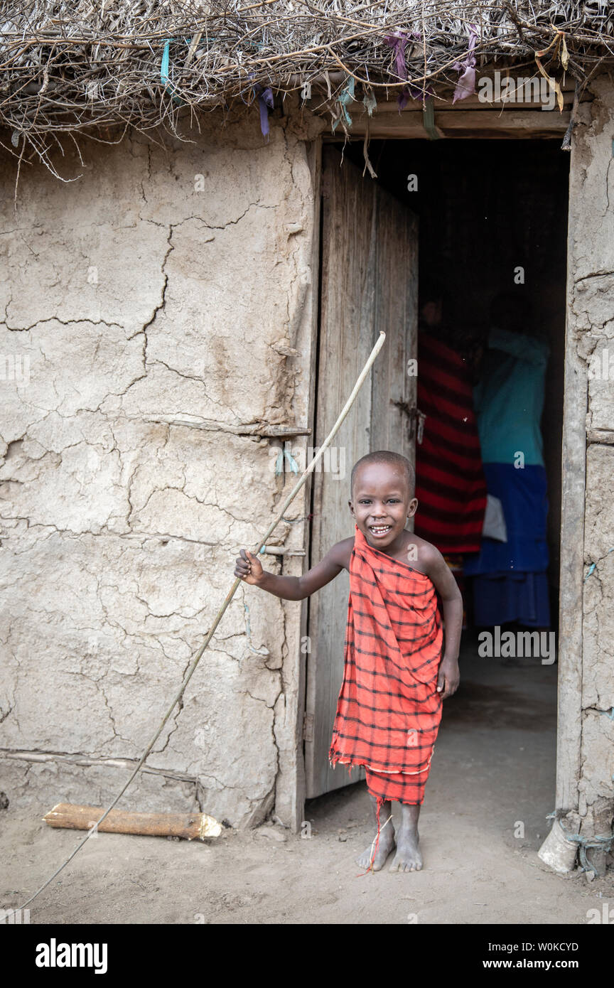 Same, Tanzania, 4th June 2019: young Maasai boy at the doorstep of his ...