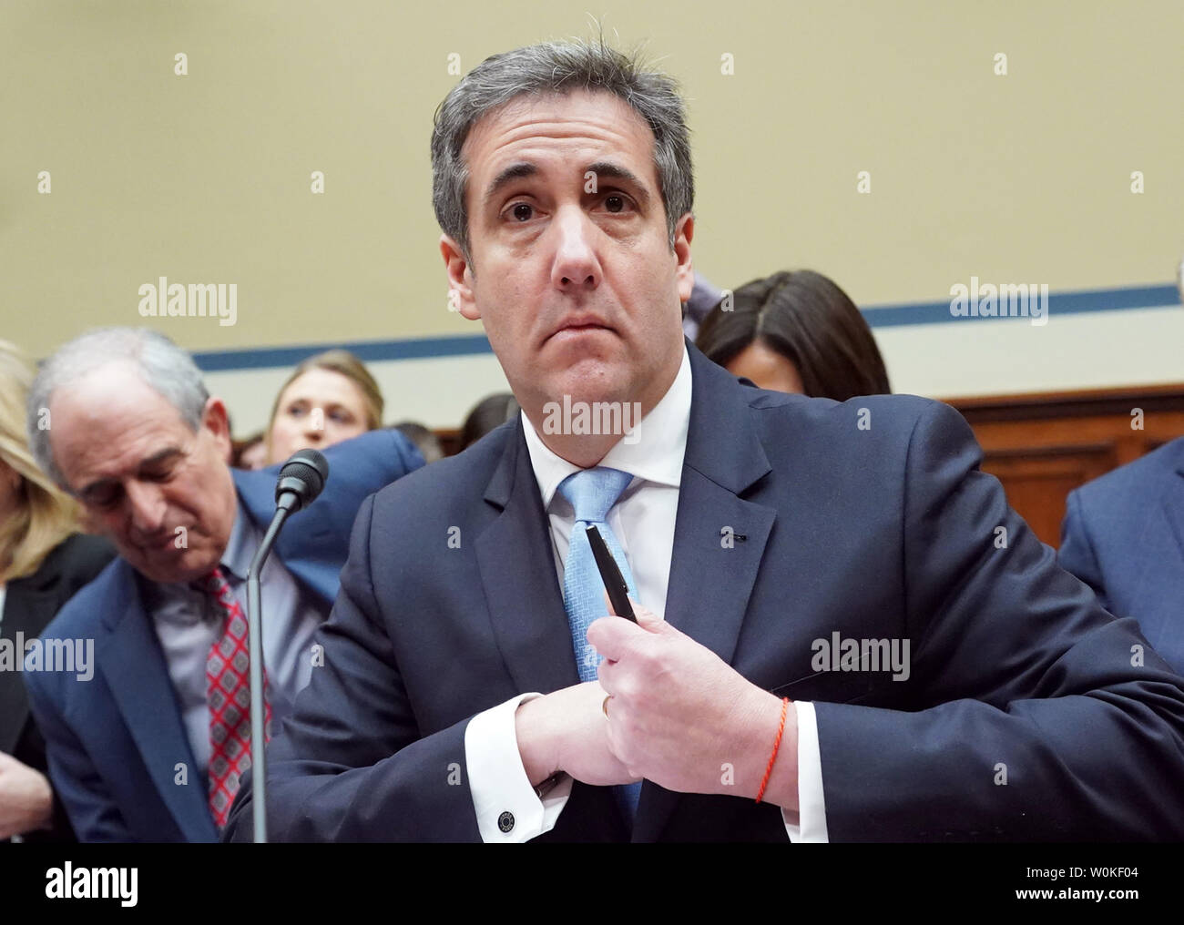 Attorney Michael D. Cohen waits to testify before the House Oversight ...