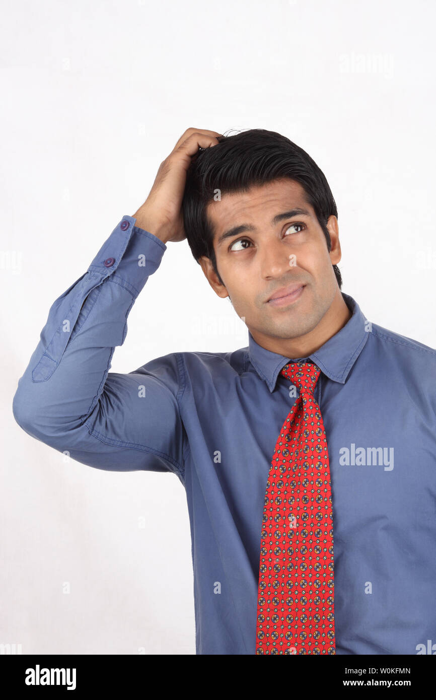 Man scratching head in office hi-res stock photography and images - Alamy