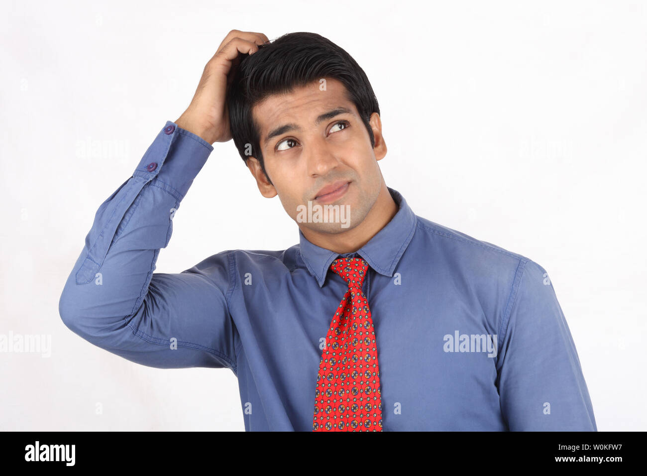 Office worker scratching head hi-res stock photography and images - Alamy