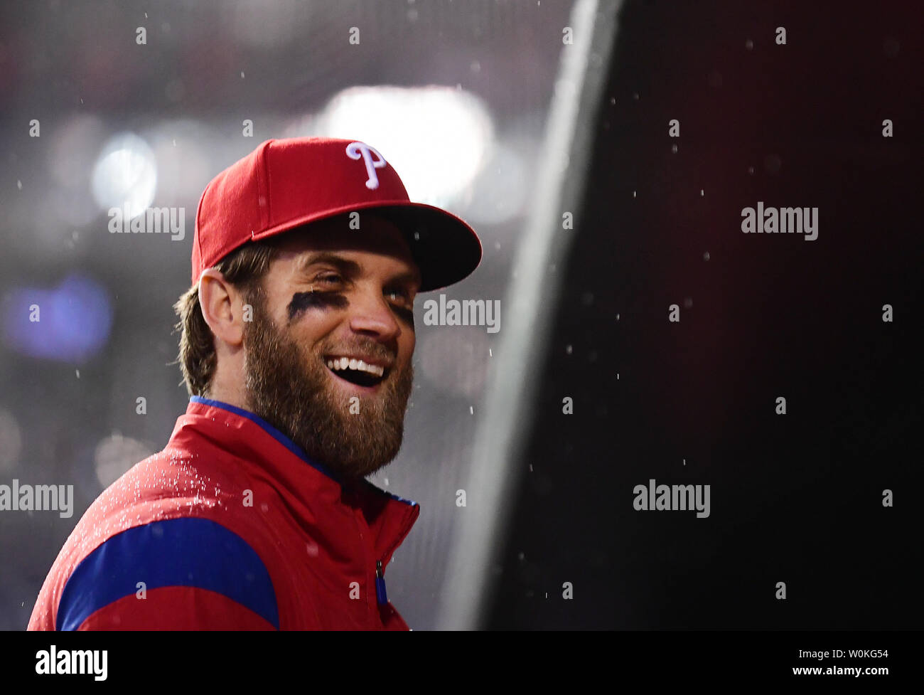 Philadelphia Phillies right fielder Bryce Harper smiles as he enters ...